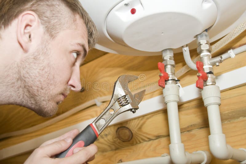 Plumber at work stock image. Image of installing, equipment - 14387497