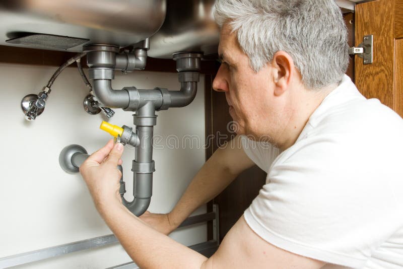 Plumber at work stock photo. Image of kitchen, occupation - 20803154
