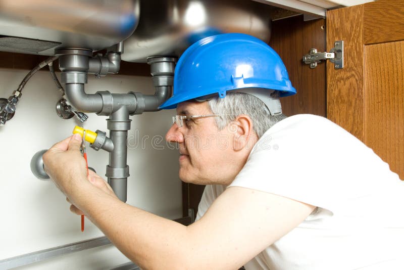 Construction Plumbing Work stock image. Image of handsome - 1418333