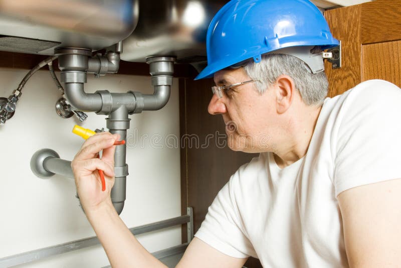 Plumber at work stock image. Image of installing, equipment - 14387497