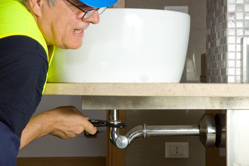 Plumber at work stock photo. Image of handsome, interior - 27649710