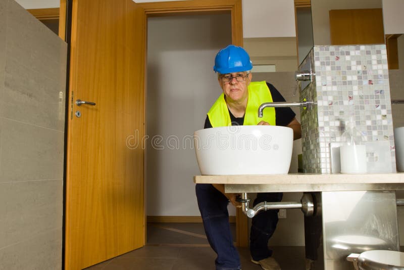 Plumber at work stock photo. Image of pipe, plumber, handyman - 27649712
