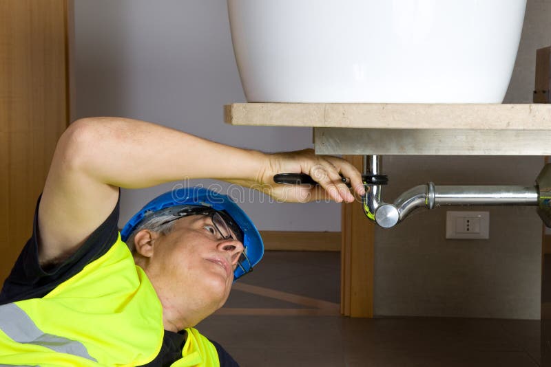 Plumber at work stock photo. Image of repairman, interior - 29313628