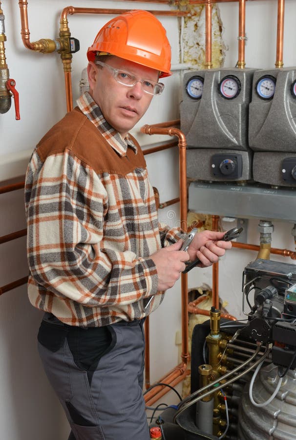 Plumber at Work stock photo. Image of boiler, work, adjustable - 30040616