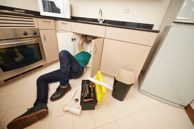 Plumber at work stock image. Image of fixing, repairman - 63770965