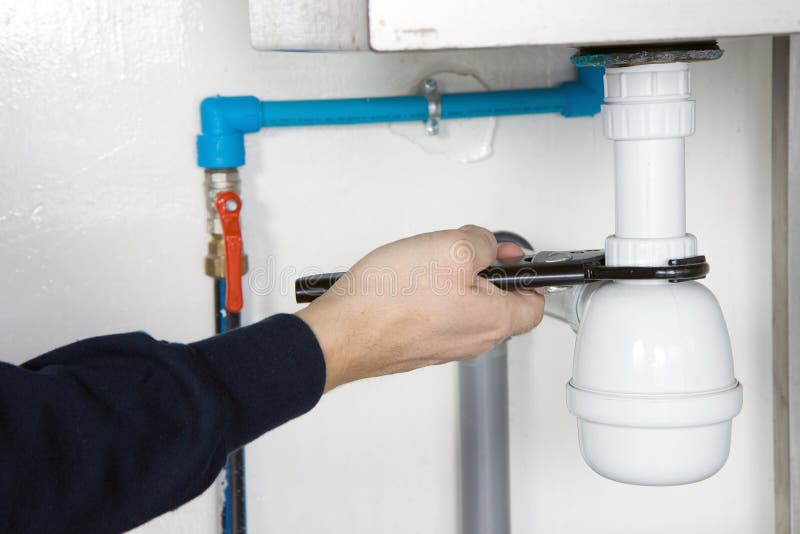 Plumber at work stock image. Image of handsome, home - 32139249