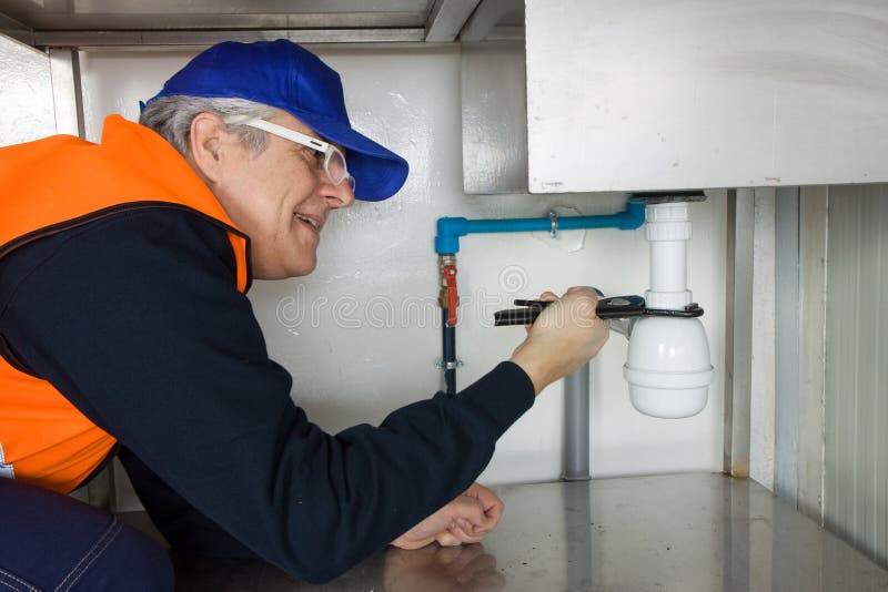 Plumber at work stock photo. Image of industrial, installing - 32139250