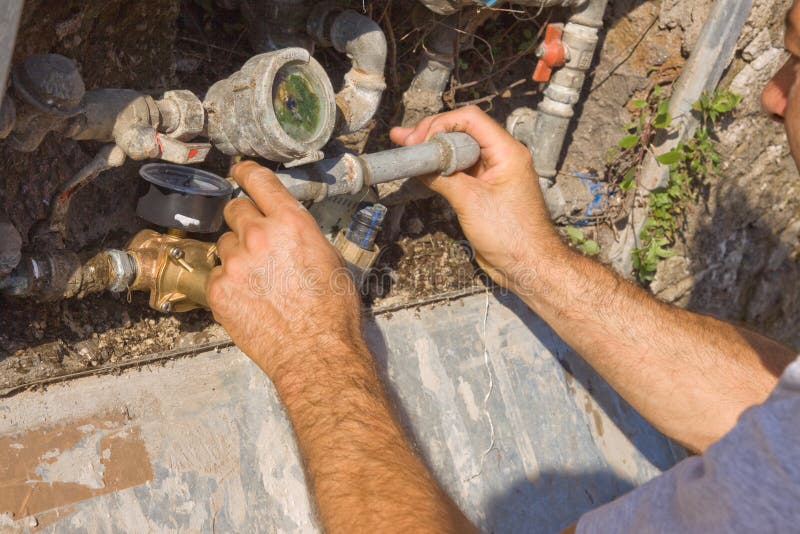 Plumber at work stock photo. Image of coveralls, house - 9797882