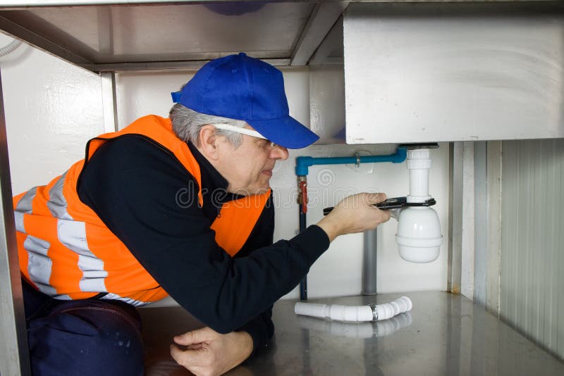 Plumber at work stock photo. Image of professional, industry - 33251576