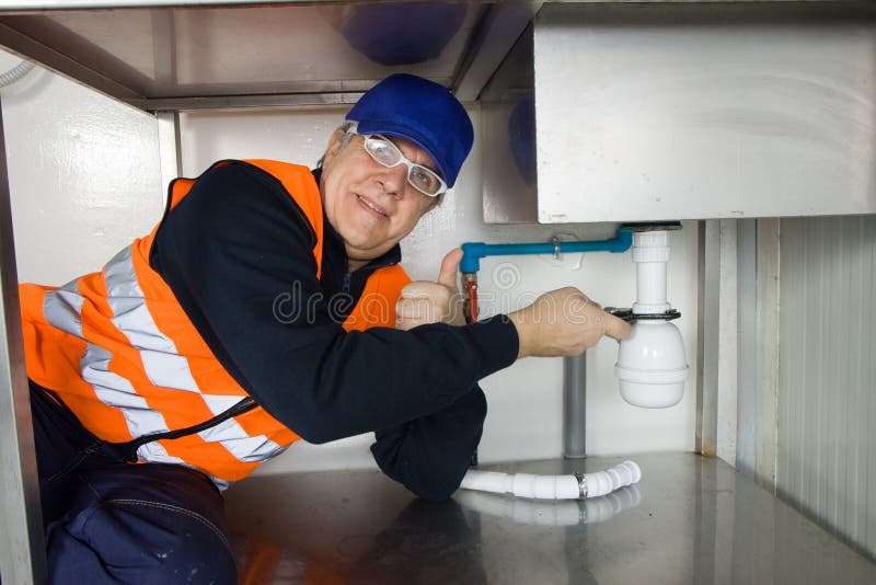 Plumber at work stock image. Image of homeowner, janitor - 33251583