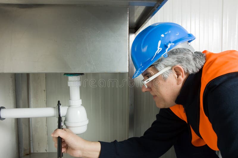 Plumber at work stock photo. Image of maintenance, brick - 33251610