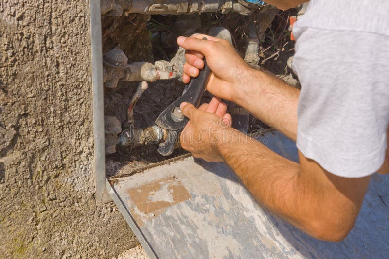 Plumber at work stock photo. Image of equipment, construction - 20762860