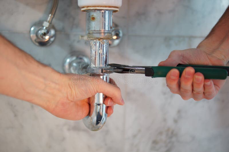 A plumber at work. stock photo. Image of expert, house - 178363452