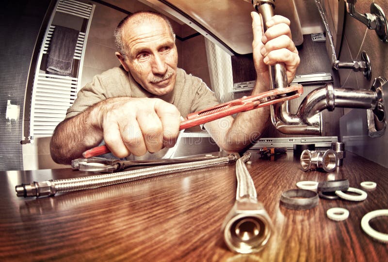 Plumber ta work stock image. Image of occupation, smiling - 24803747