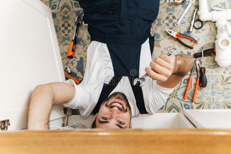 Plumber Work in Uniform Indoors Stock Image - Image of kitchen, plumber ...