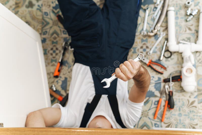 Plumber Work in Uniform Indoors Stock Photo - Image of handsome ...