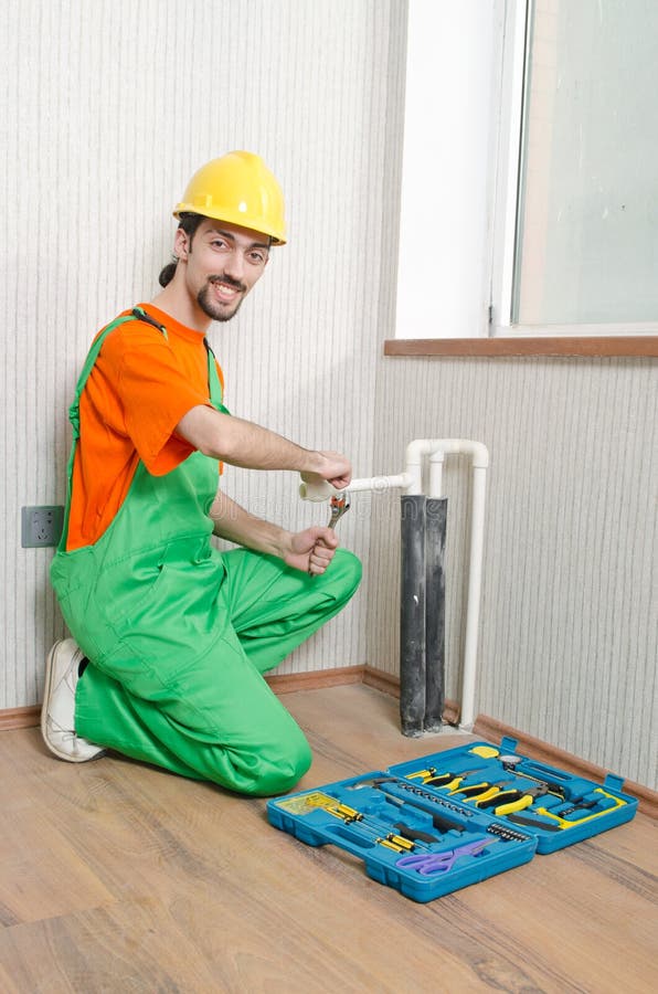 Plumber Working in Bathroom Stock Image - Image of pipe, caucasian ...