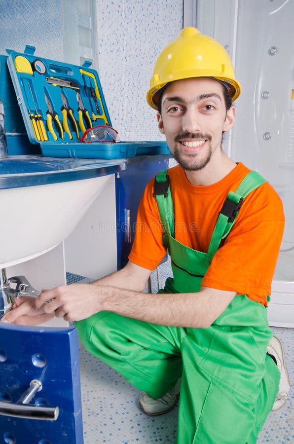 Plumber Working in Bathroom Stock Photo - Image of profession, repair ...