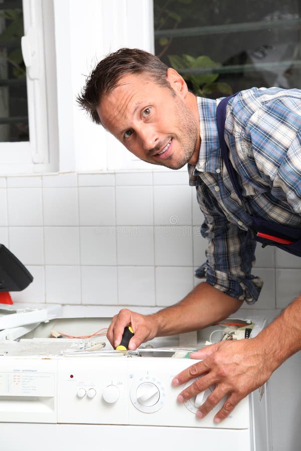 Plumber Working on Domestic Appliance Stock Image - Image of caucasian ...