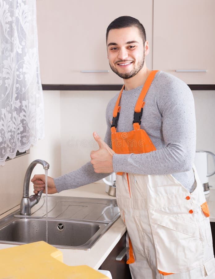 Plumber Working at Home of Client Stock Photo - Image of clothing ...