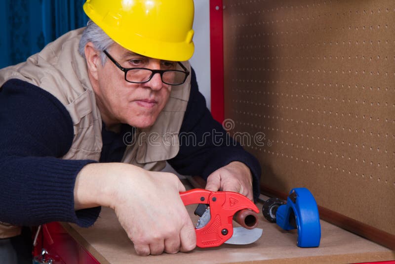 Plumber working with pipes stock image. Image of contractor - 88975213