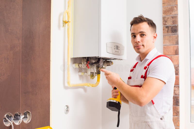 The Plumber Works with Boiler at the Kitchen Stock Photo - Image of ...