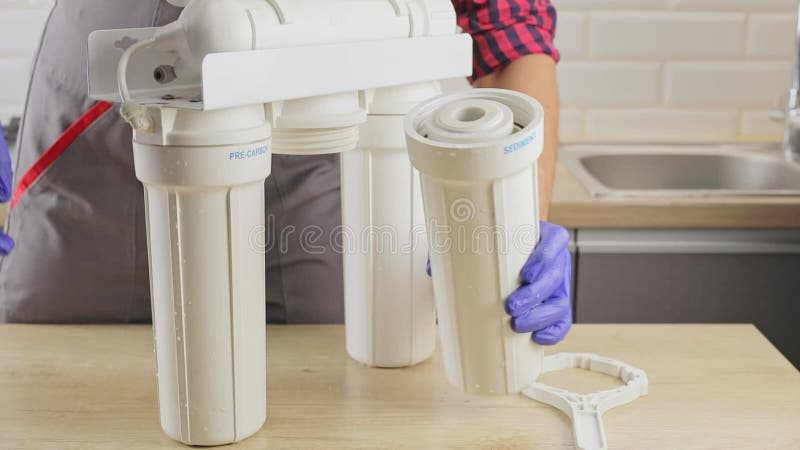 Plumber Works with a Replaceable Water Filter. Filtration by Reverse ...