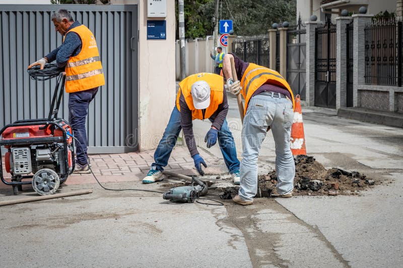 Plumbers Prepares To Fix the Problem in the Sewer. Repair Work on ...