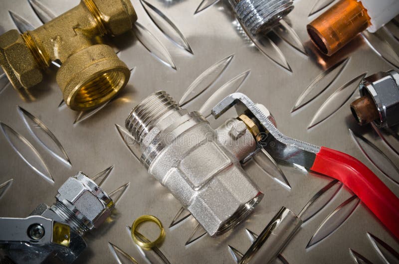Plumbing Kit on a Metal Surface Stock Photo - Image of pipe, conduit ...