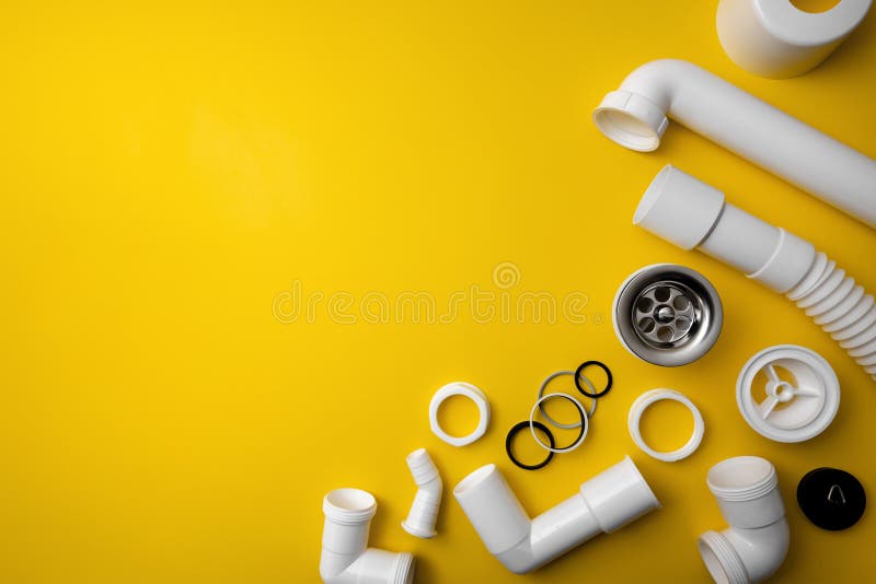 Plumbing Pvc Plastic Parts on Yellow Background Stock Photo - Image of ...