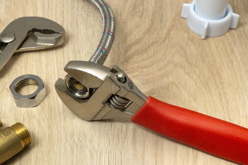 Plumbing Tools and Replacement Parts on a Wooden Table Stock Image ...