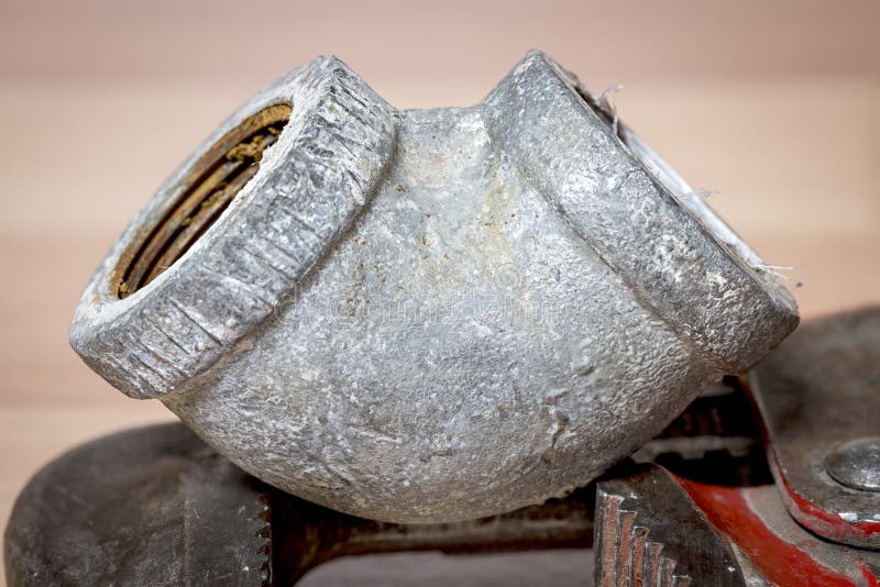 Plumer Pipe that is an Elbow Stock Photo - Image of handyman, metal ...