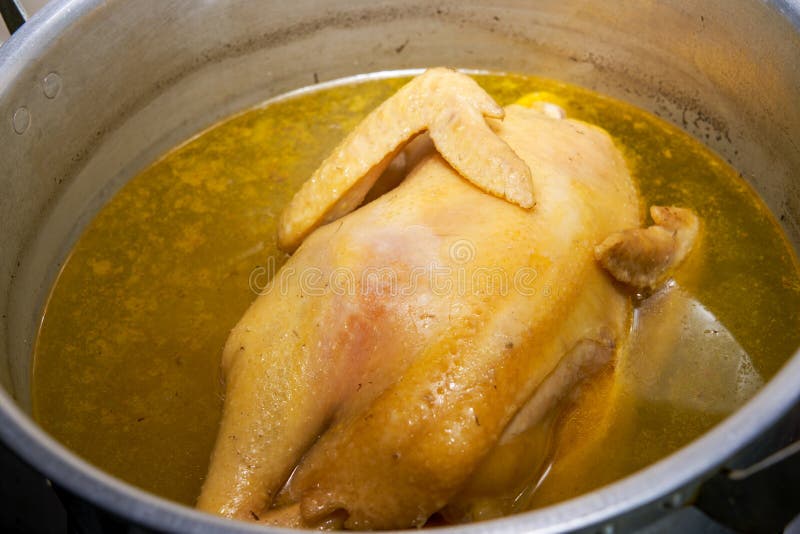 A Plump Cantonese White-cut Chicken Being Cooked in the Pot Stock Image ...