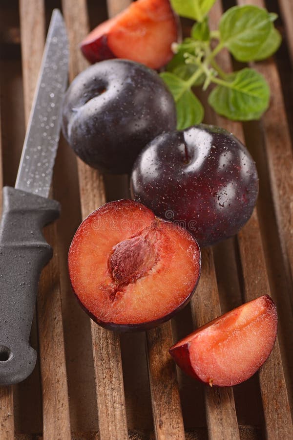 Plums Cut on the Cutting Board Stock Image - Image of ripe, organic ...