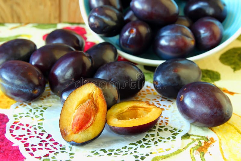 Plums, cut in half stock photo. Image of dessert, fruits - 43649456