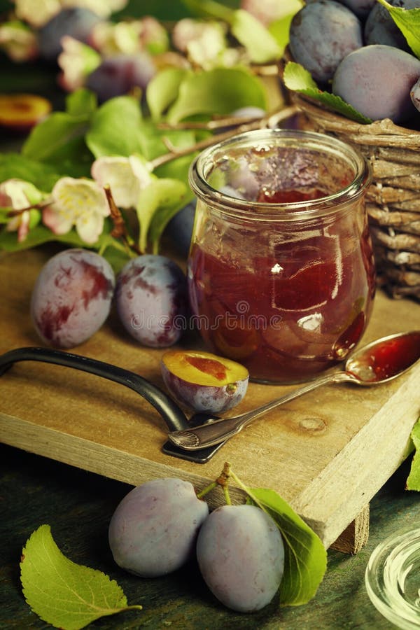 Plums and Jar of Jam on Table Stock Image - Image of food, natural ...