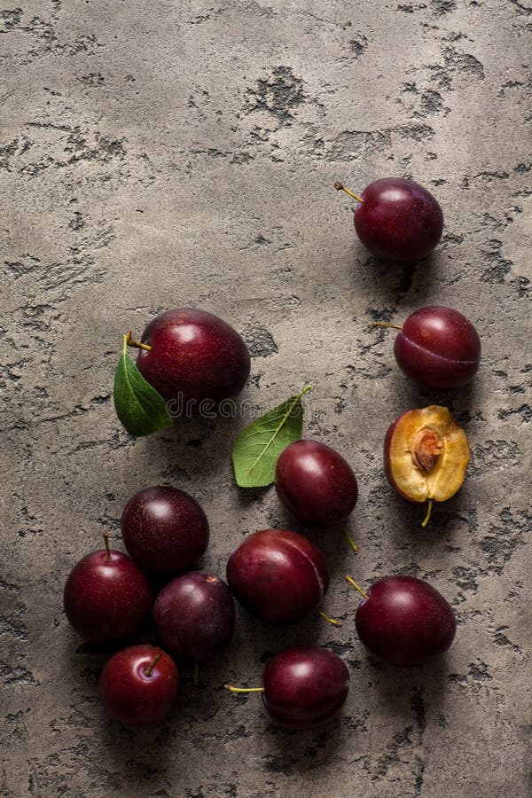 Plums on stone background stock photo. Image of harvest - 120280488
