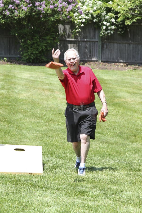 80 Plus Old Man Playing Cornhole Stock Photo - Image of sport, bright ...