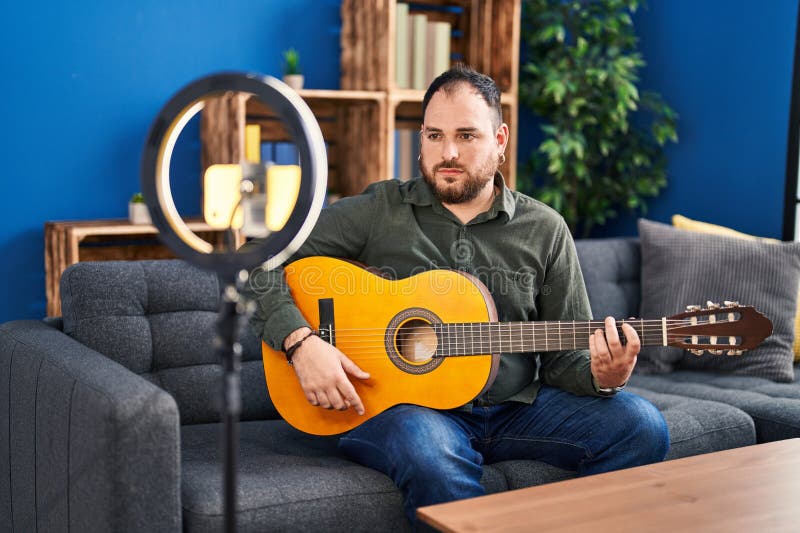 Plus Size Hispanic Man with Beard Playing Classic Guitar at Music ...