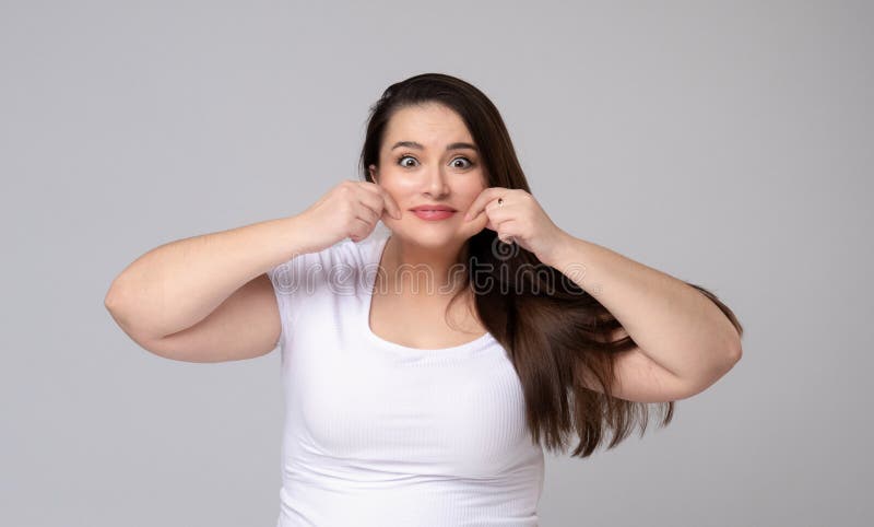 Pull the cheeks stock photo. Image of eyes, asian, close - 36030974