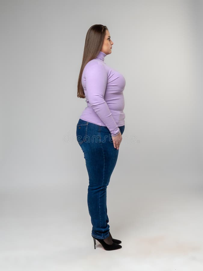 Plus Size Model with Long Hair Posing in Studio Stock Photo - Image of ...