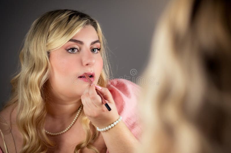 Plus Size Woman Applying Makeup Using Lip Pencil Stock Image - Image of ...
