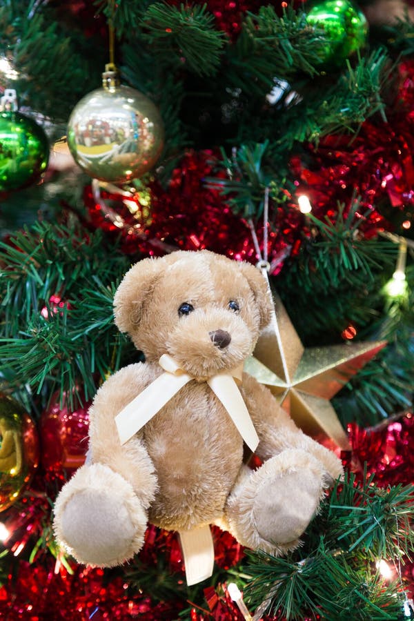 Plush Bear with Ornaments and Christmas Tree Background Stock Photo ...