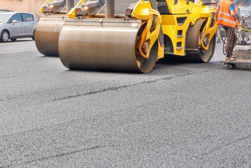 Pneumatic Steam Road Rollers Compact Fresh Asphalt on the Road in Front ...