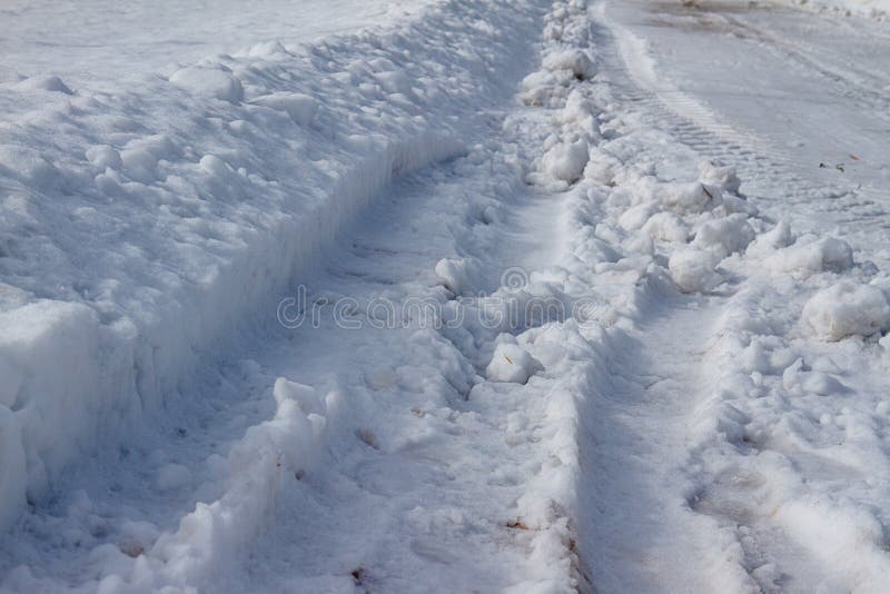 Pneumatic Trace on a Snowy Road Stock Photo - Image of snow, covering ...