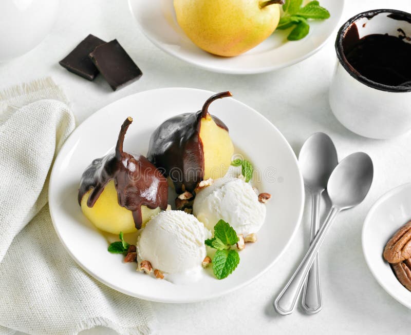 Poached Pears with Chocolate Sauce and Ice Cream Stock Image - Image of ...