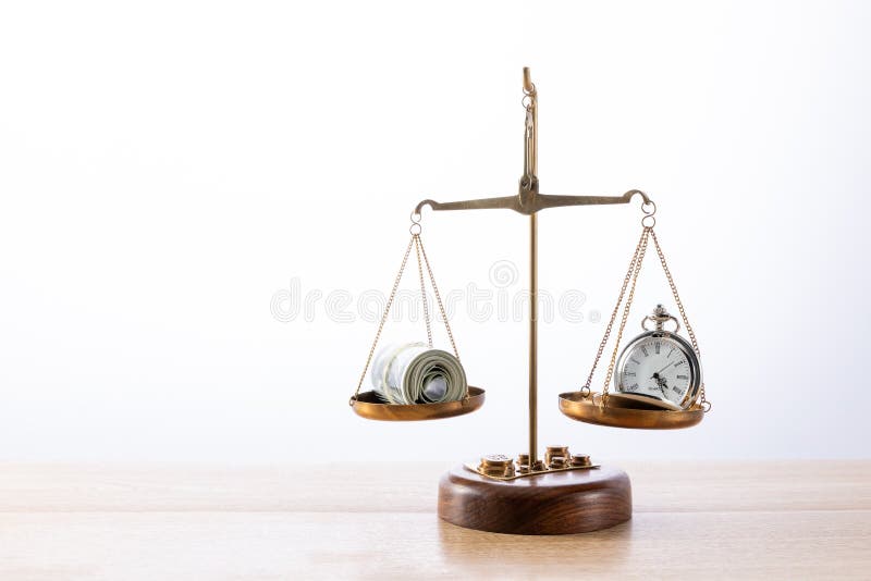 Pocket Clock and Some Money Scaling Equally on a Scale on a Wooden ...