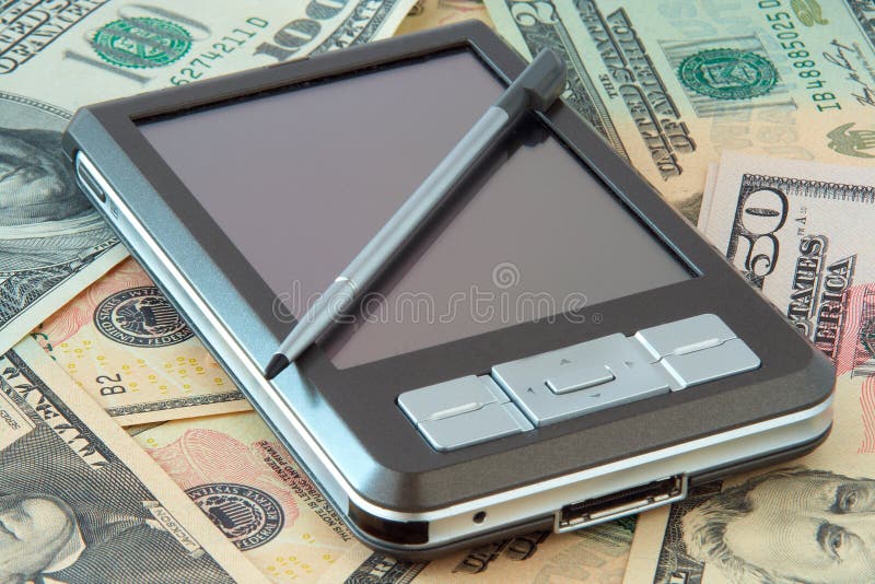 Pocket PC on dollars stock photo. Image of finance, currency - 10871778