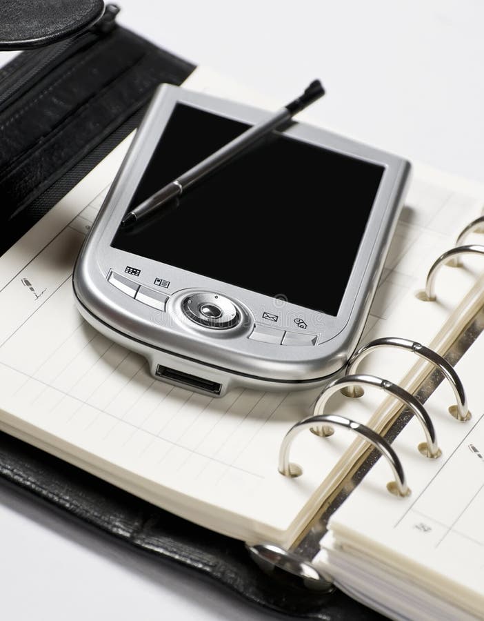 PDA on a Book stock image. Image of computer, money, mini - 97827