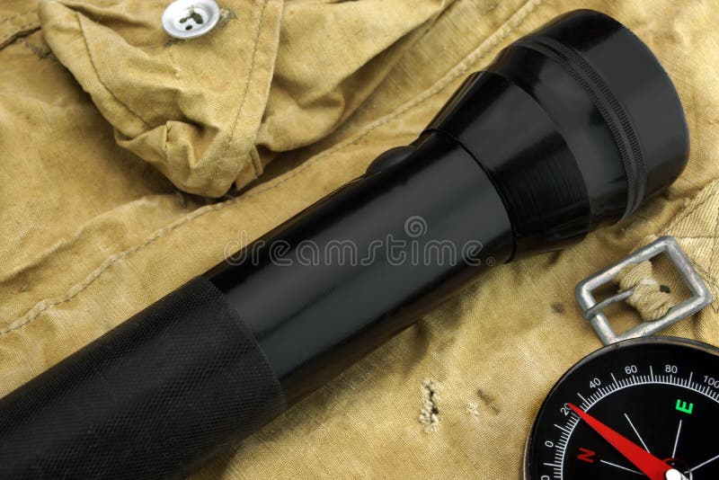 Pocket Searchlight and Compass on Backpack Stock Image - Image of ...